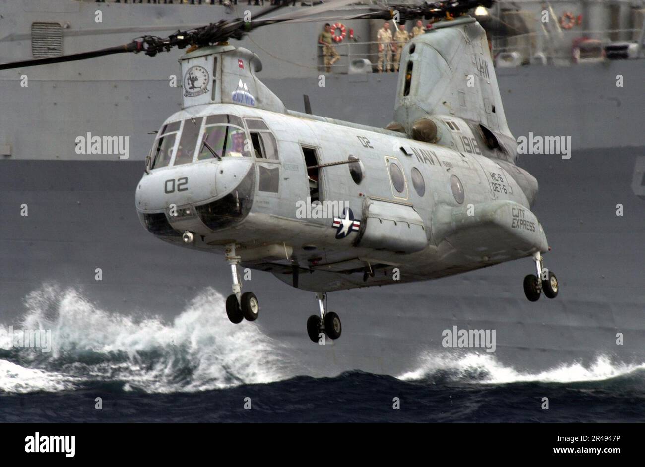 US Navy A CH-46 Sea Knight carries supplies and stores during a ...