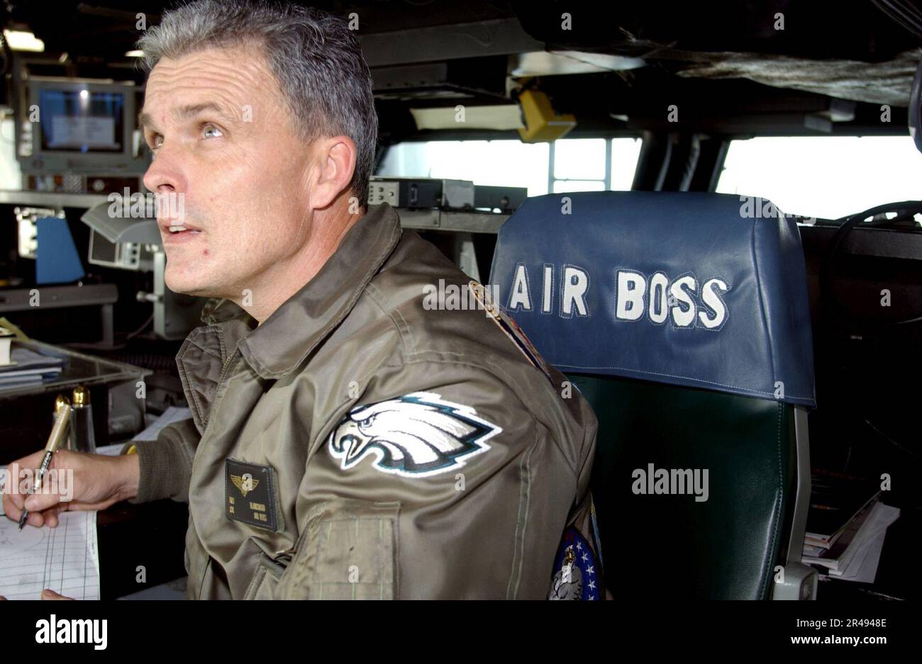 US Navy Cmdr. Fred Blanchard, from Philidelphia, Pa., looks at the day ...