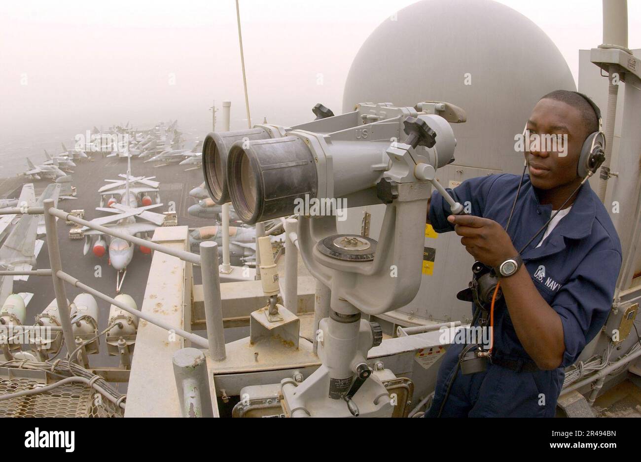US Navy The forward look out maintains his post on the signal bridge ...