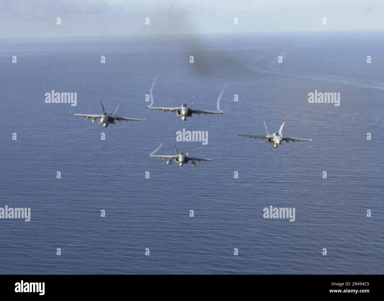 US Navy F-A-18E Superhornets fly in a diamond formation over the ...