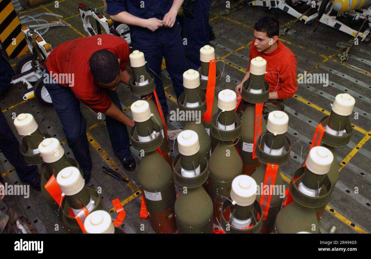 US Navy Aviation Ordnancemen prepare Computer Control Guided Bomb Units ...