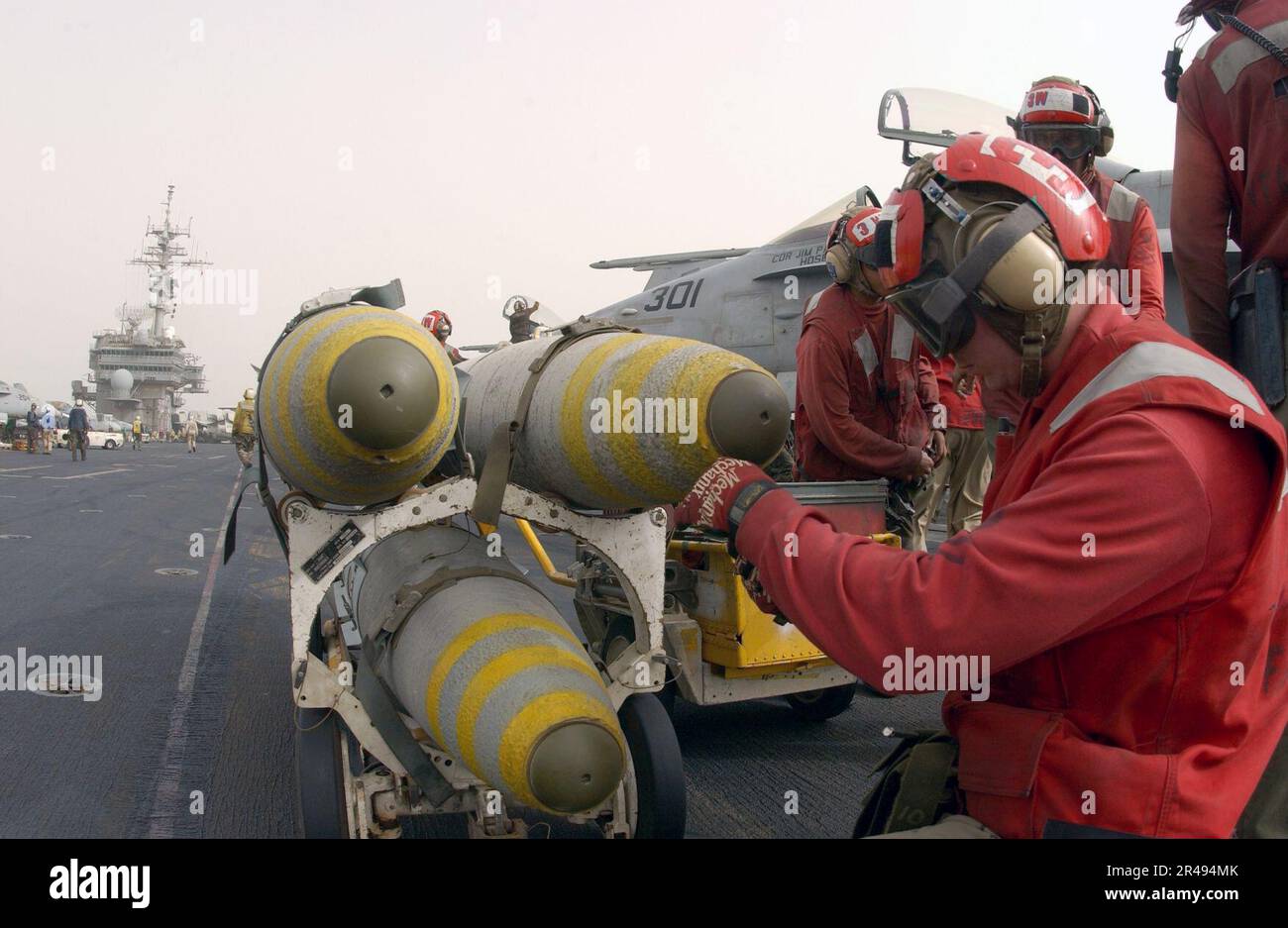 US Navy Aviation ordnancemen transfer GBU-31 joint defense attack ...