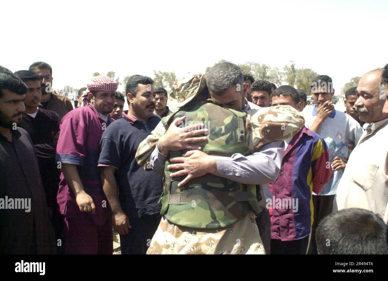US Navy A member of the Free Iraqi Forces (FIF) is reunited with family ...