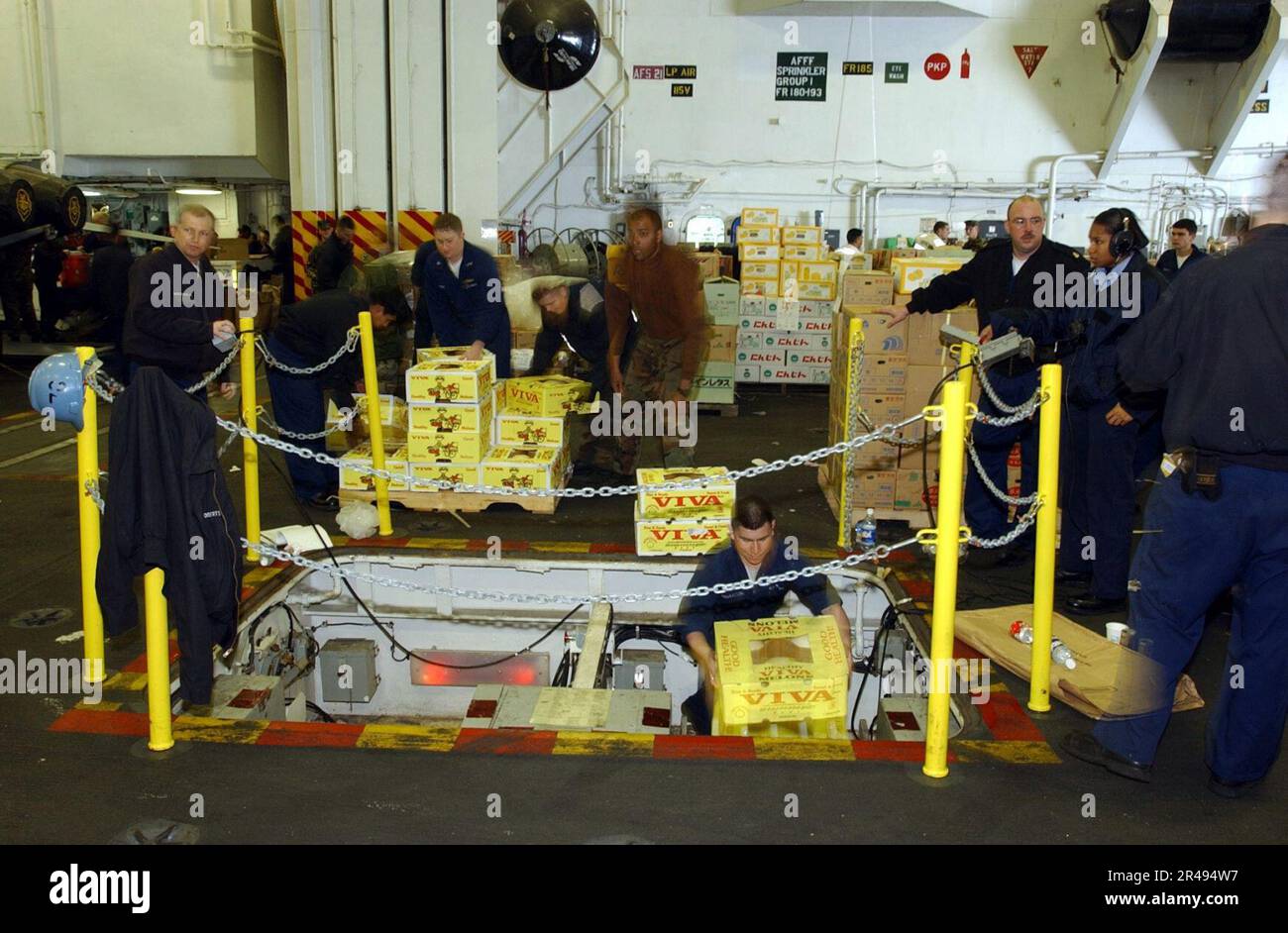 US Navy A working party moves the cargo from the hangar bay to the ...