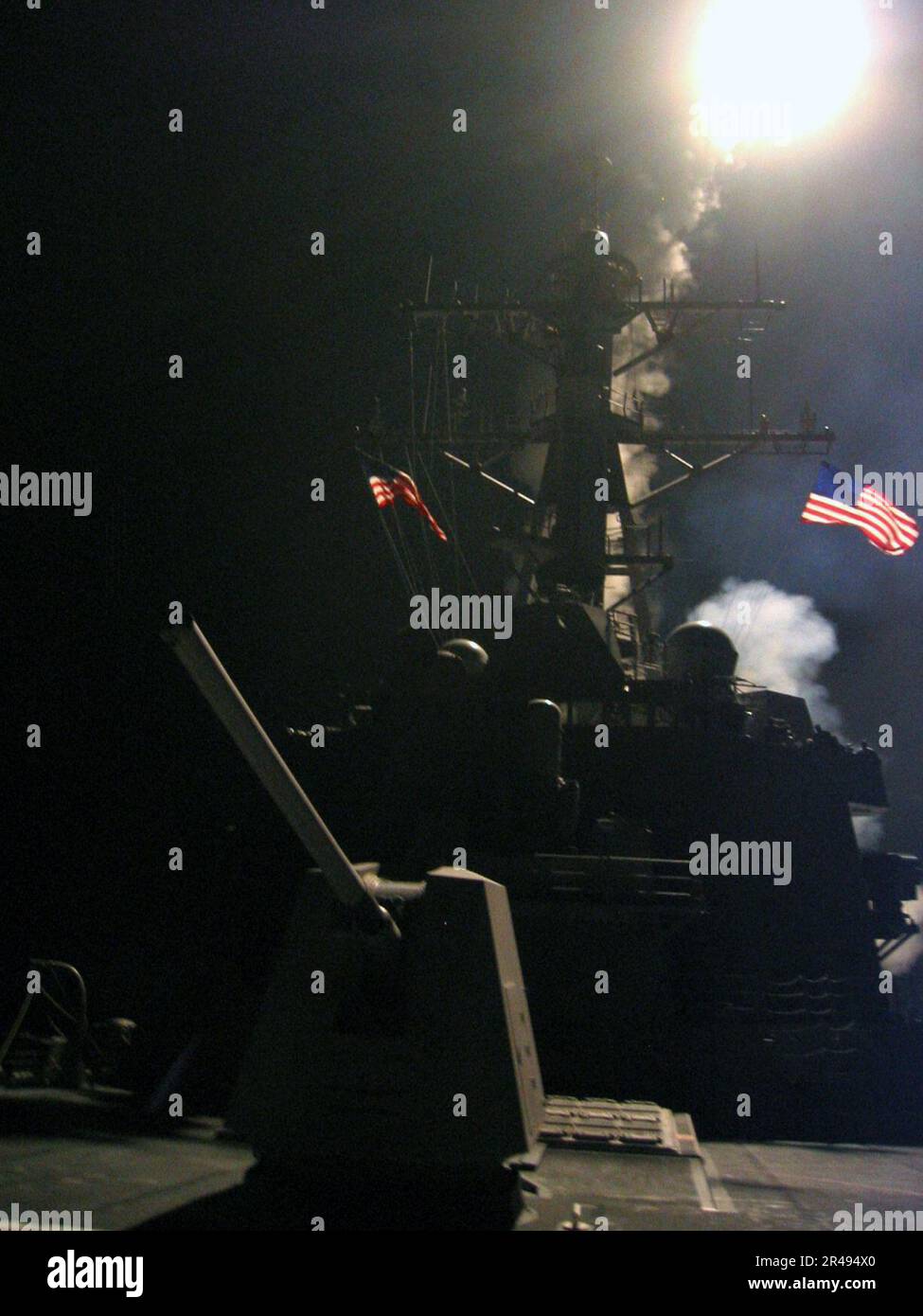 US Navy A Tomahawk land attack missile's (TLAM) booster lights up the ...