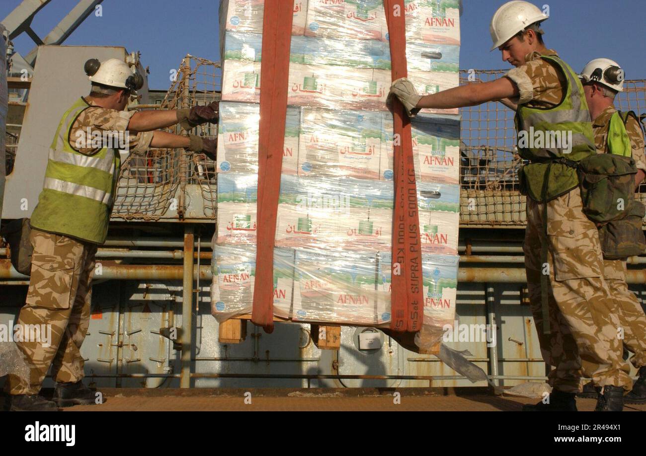 US Navy Bottled water is delivered by crane to the port of Umm Qasr ...