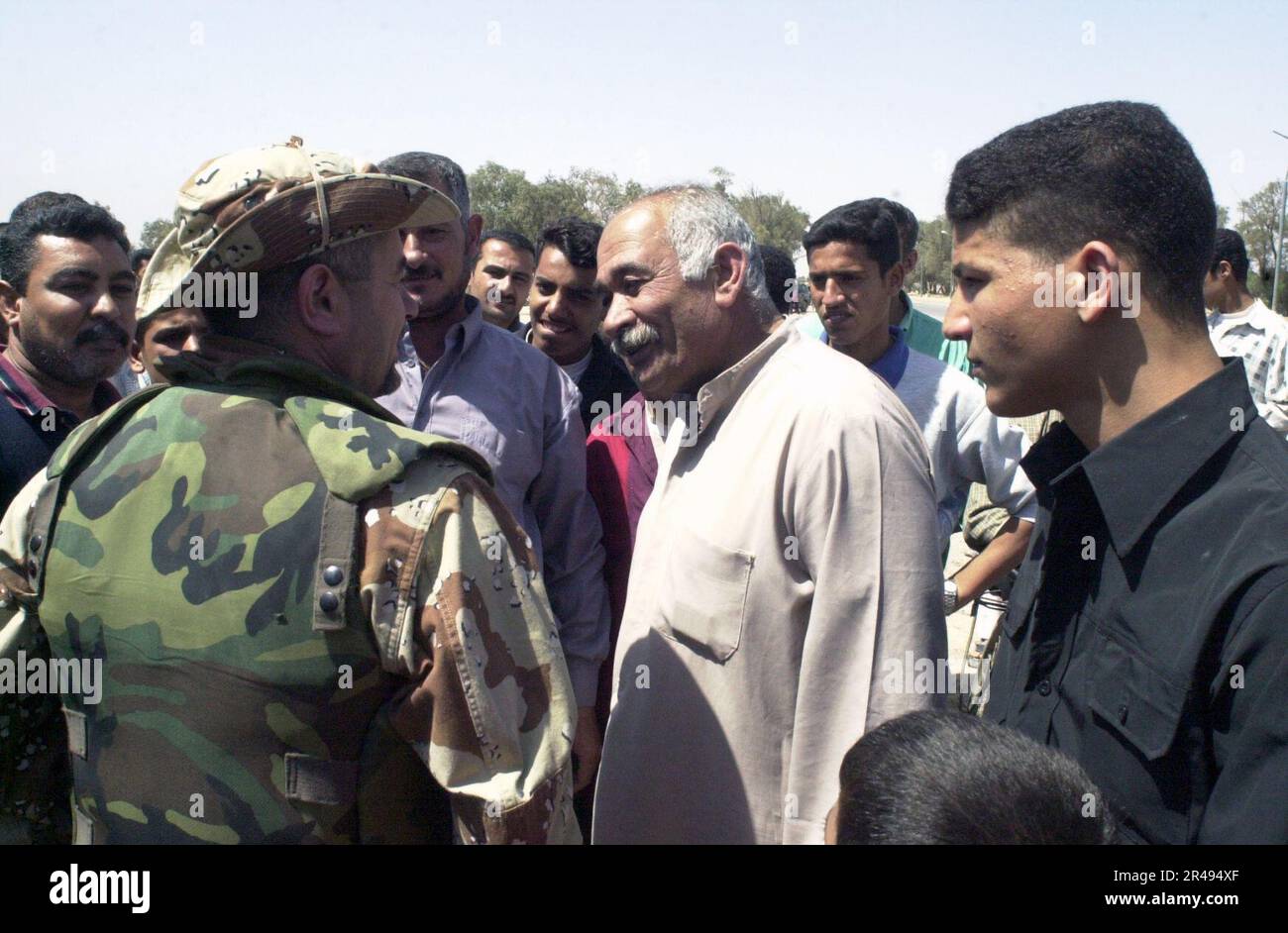 US Navy A member of the Free Iraqi Forces (FIF) is reunited with family ...