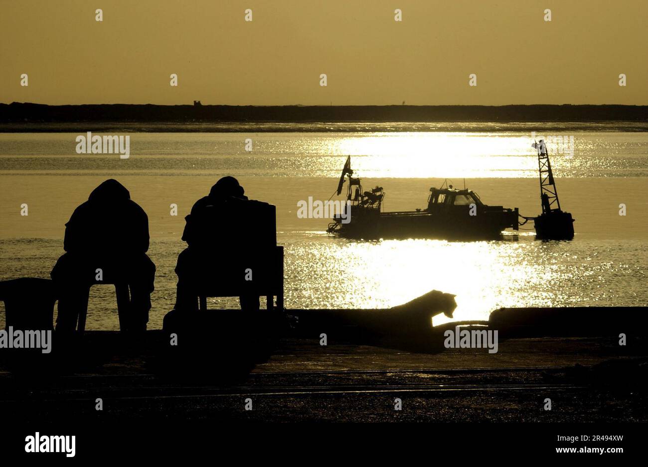 US Navy Members of Commander Task Unit (CTU-55.4.3) watch the sunrise ...