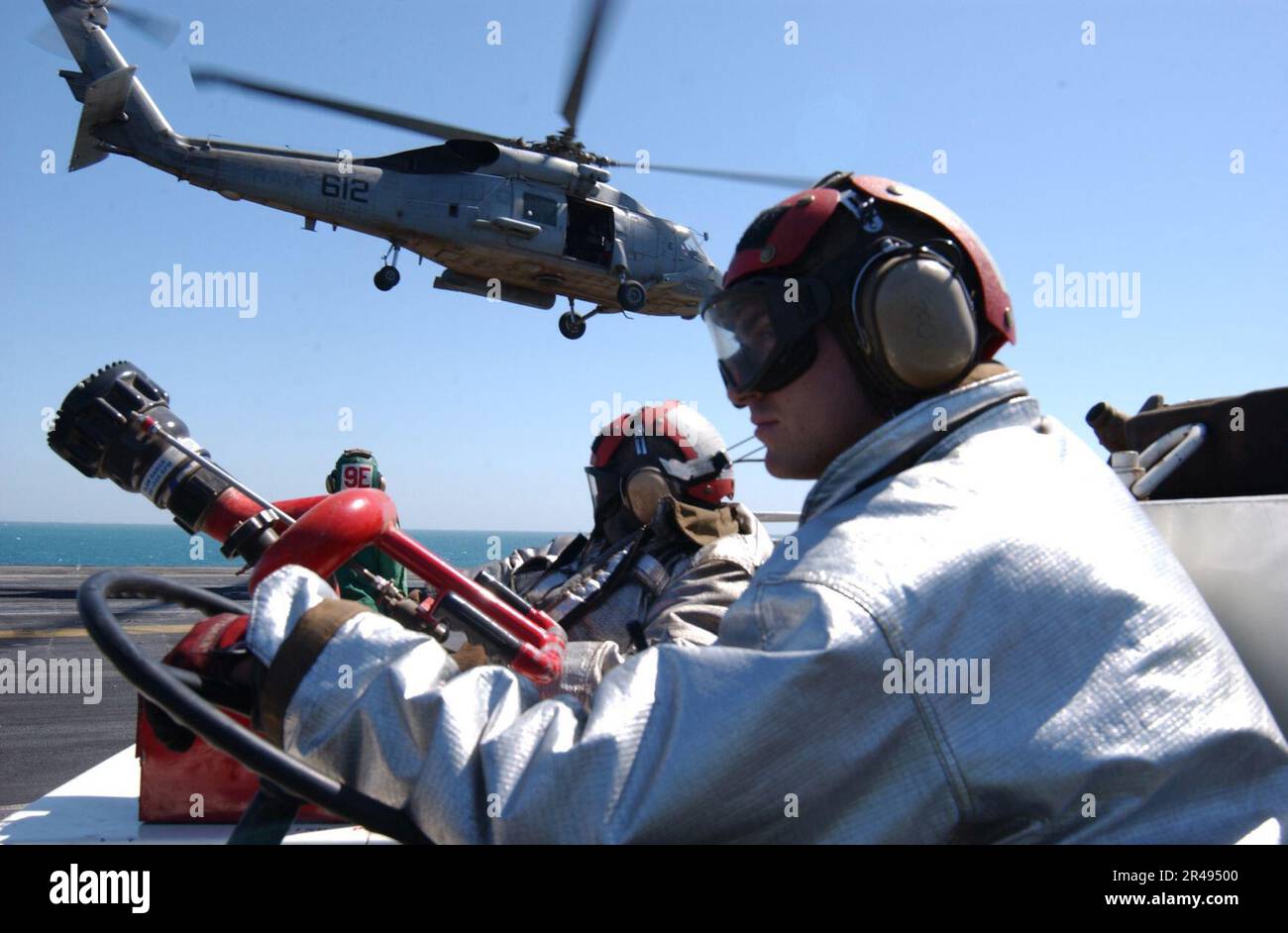 US Navy Crash and Salvage crewmembers standby during daily flight ...