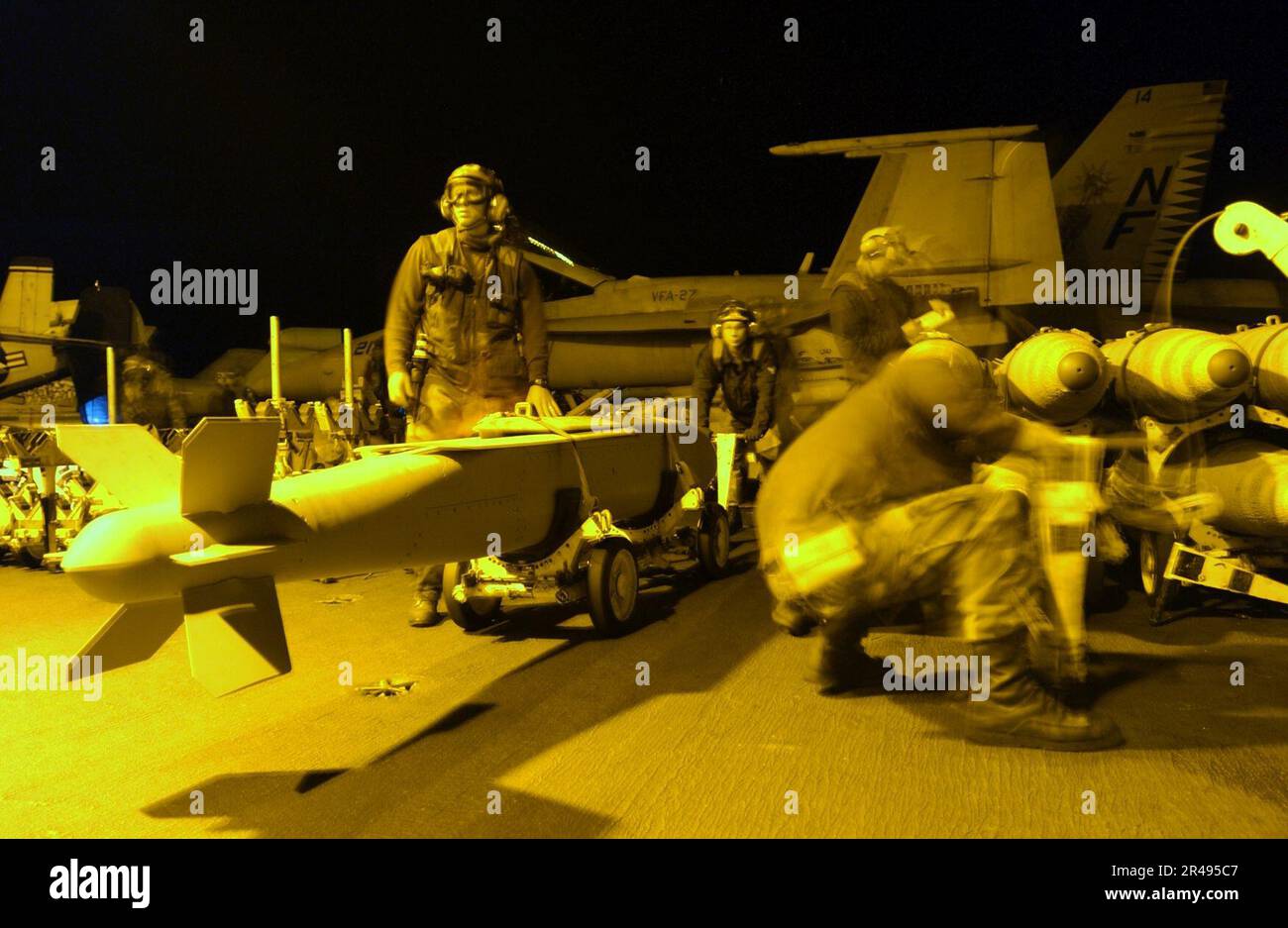 US Navy Aviation ordnancemen relocate a Joint Stand-off Weapon (JSOW ...