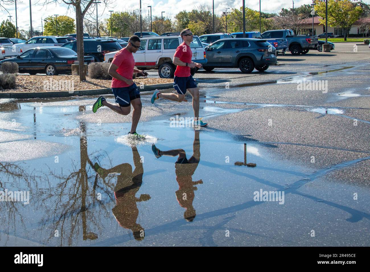 U.S. Airmen participate in a warrior fun run obstacle course at Travis ...