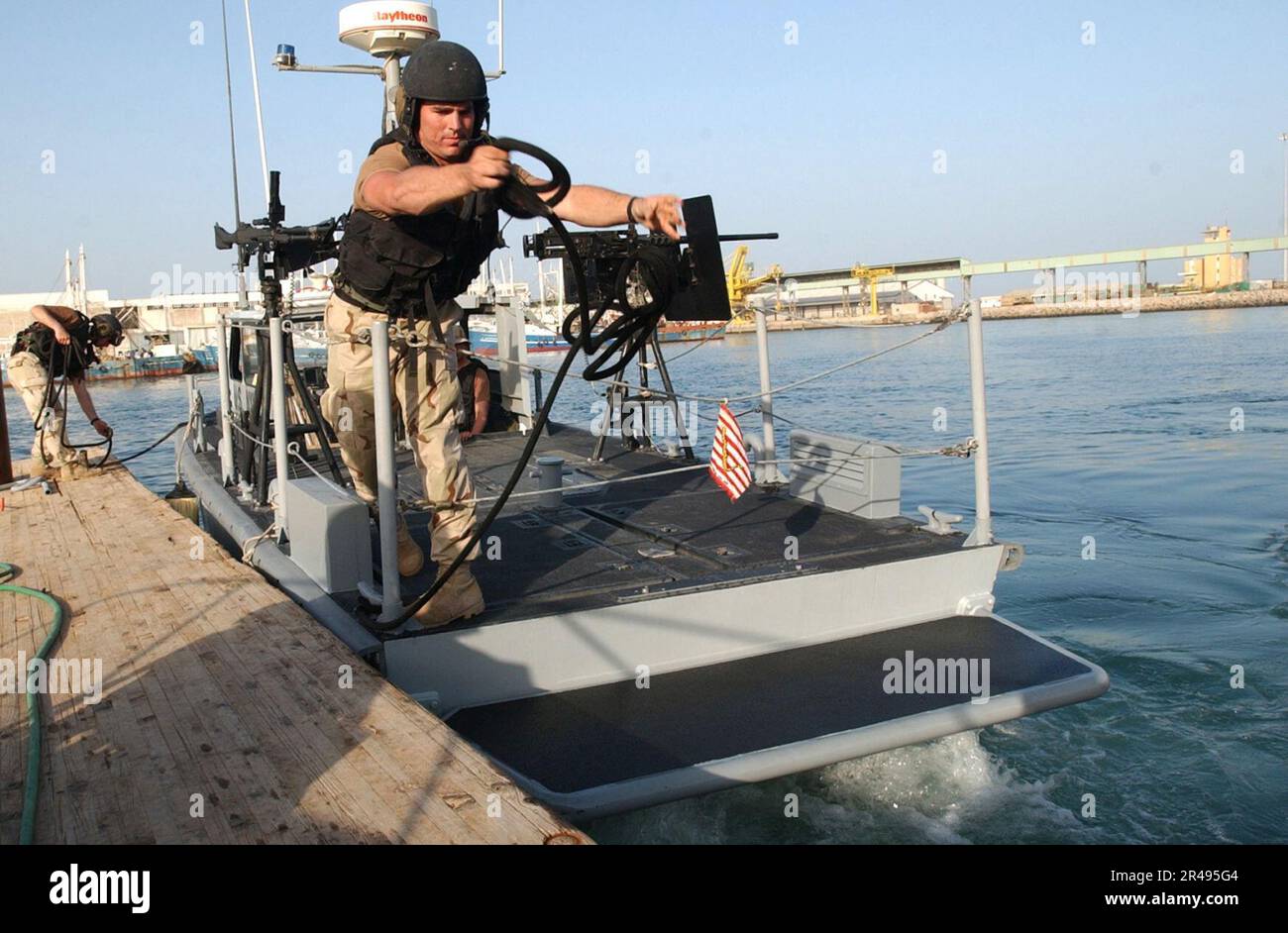 US Navy Members of a boat crew assigned to Inshore Boat Unit Fourteen ...