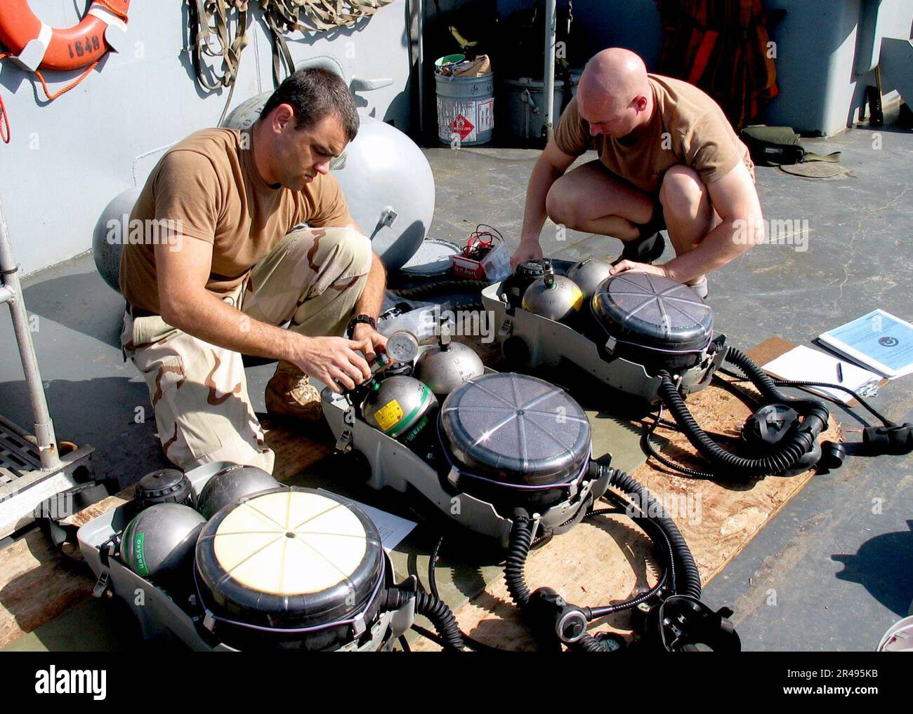 US Navy EOD personnel conduct checks on their equipment before ...