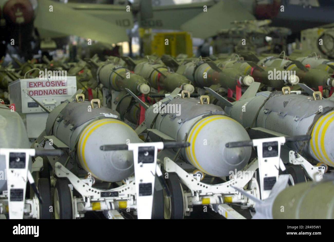 US Navy Various bombs are staged in the hanger bay for inspection prior ...