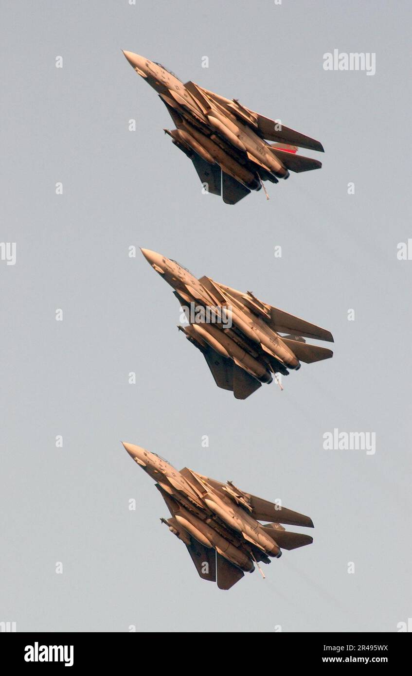 US Navy F-14A Tomcats fly in formation on final approach to USS Kitty ...