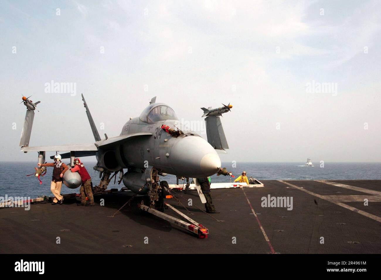 US Navy An F-A-18 Hornet sits on the fantail aboard USS Harry S. Truman ...
