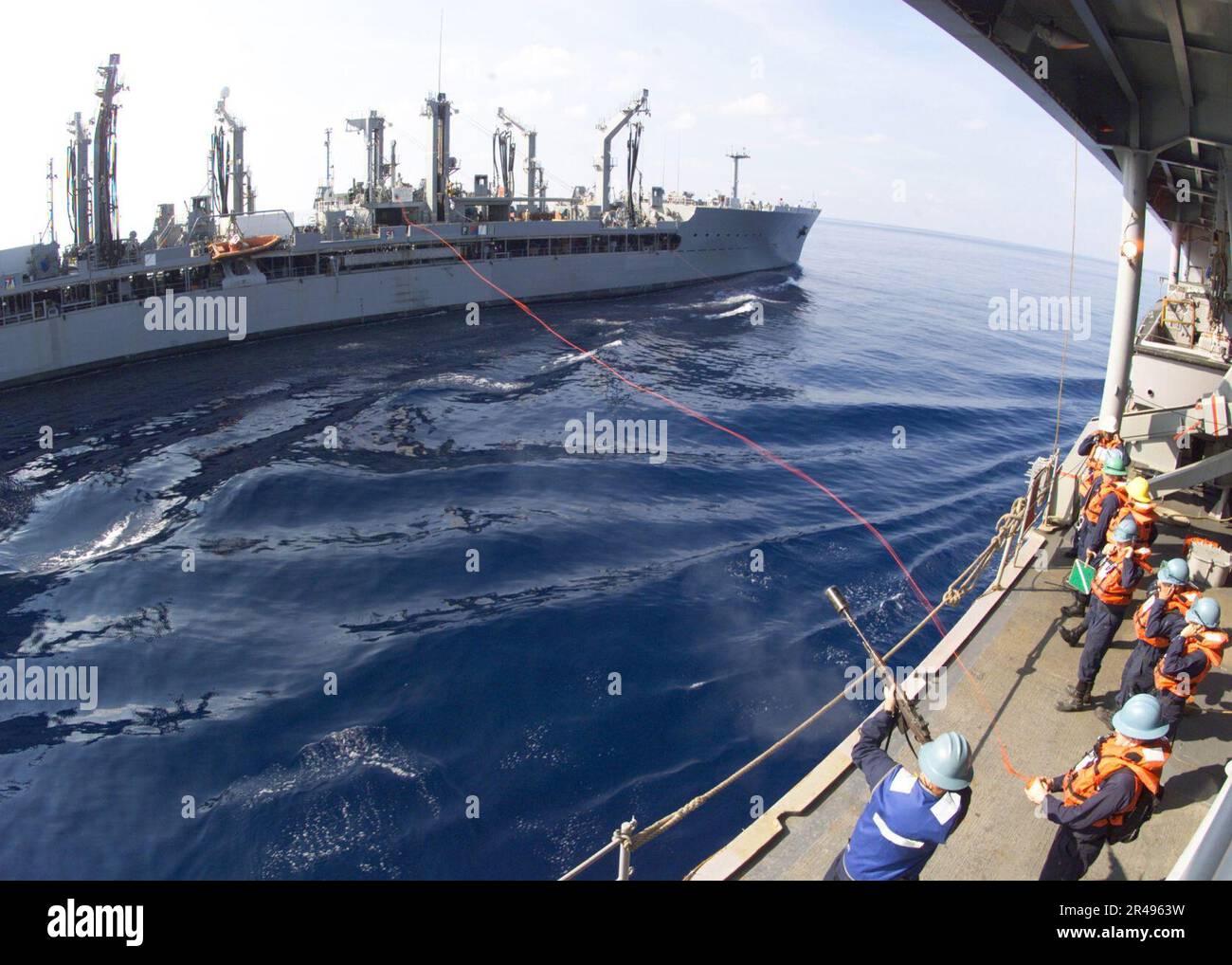 US Navy A shot-line is fired from the amphibious command ship USS Blue ...