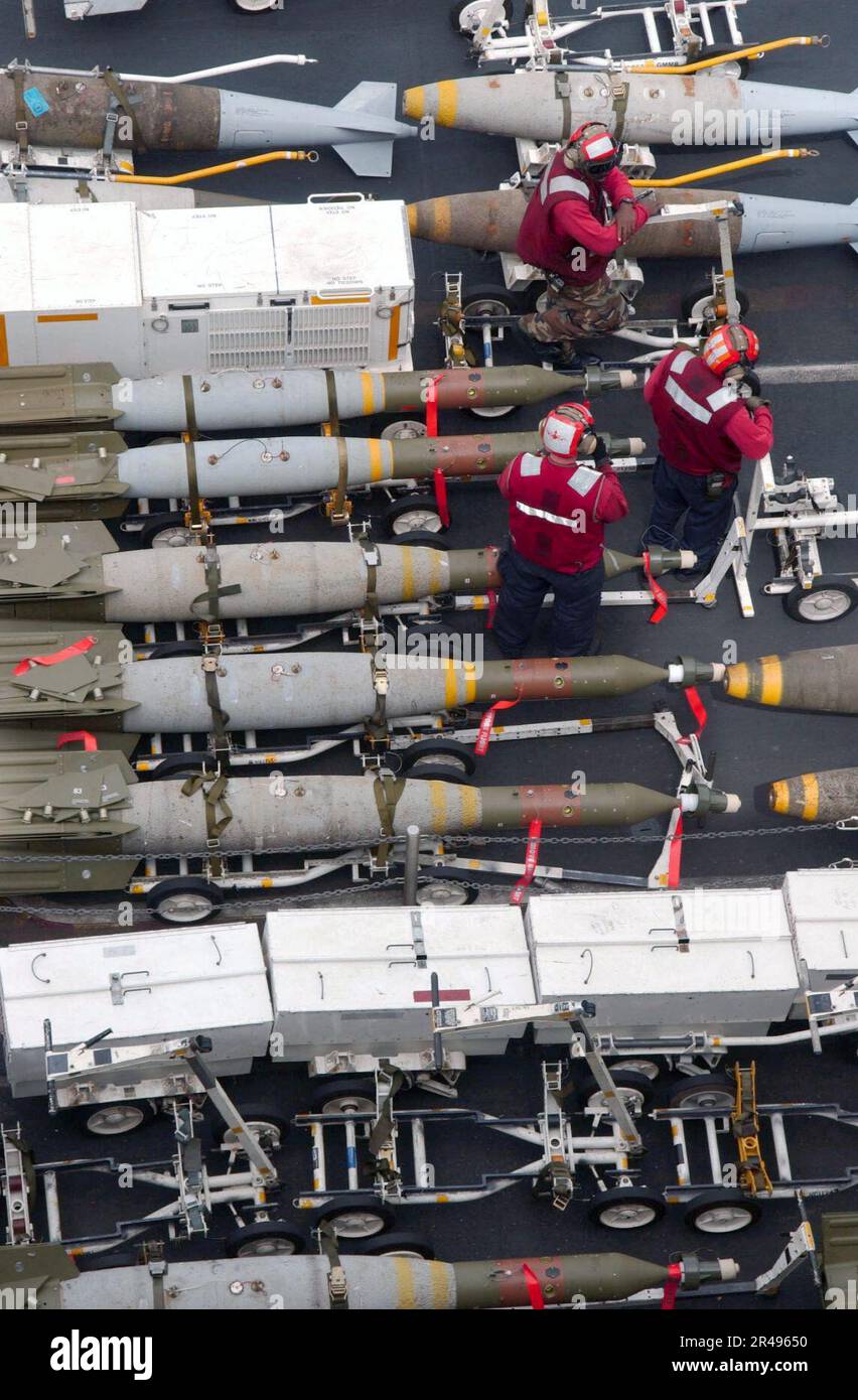 US Navy Aviation Ordnancemen stand watch in the 'bomb farm' aboard USS ...