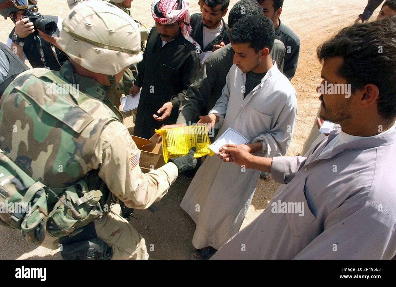 US Navy A paratrooper assigned to the 82nd Airborne Division hands out ...