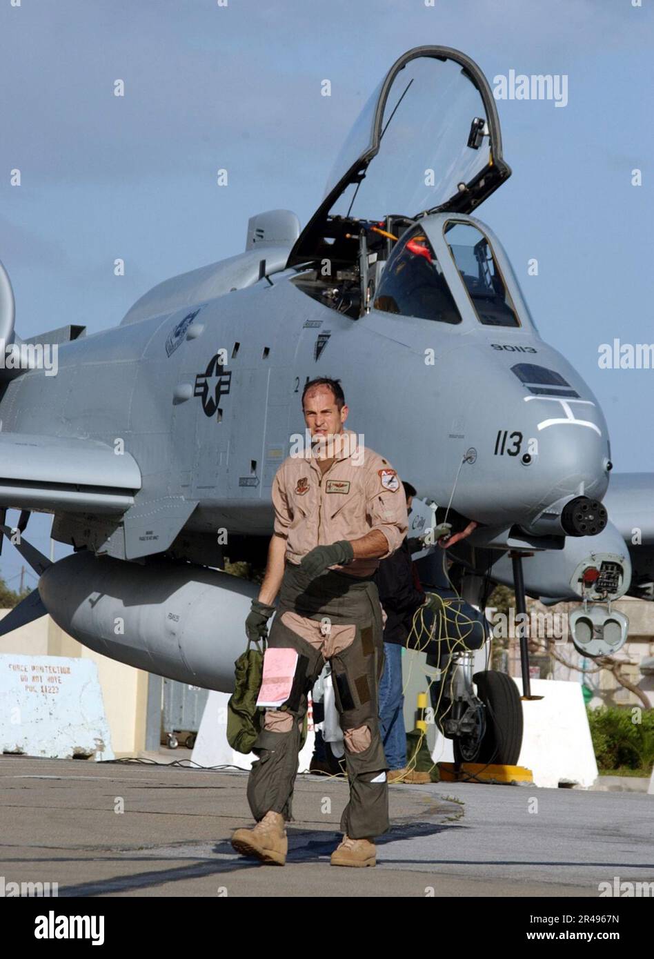 US Navy A U.S. Air Force pilot departs his A-10 Thunderbolt at a stop ...