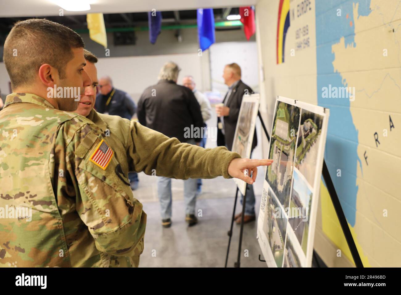 New York Army National Guard Soldiers examine renderings of a new ...