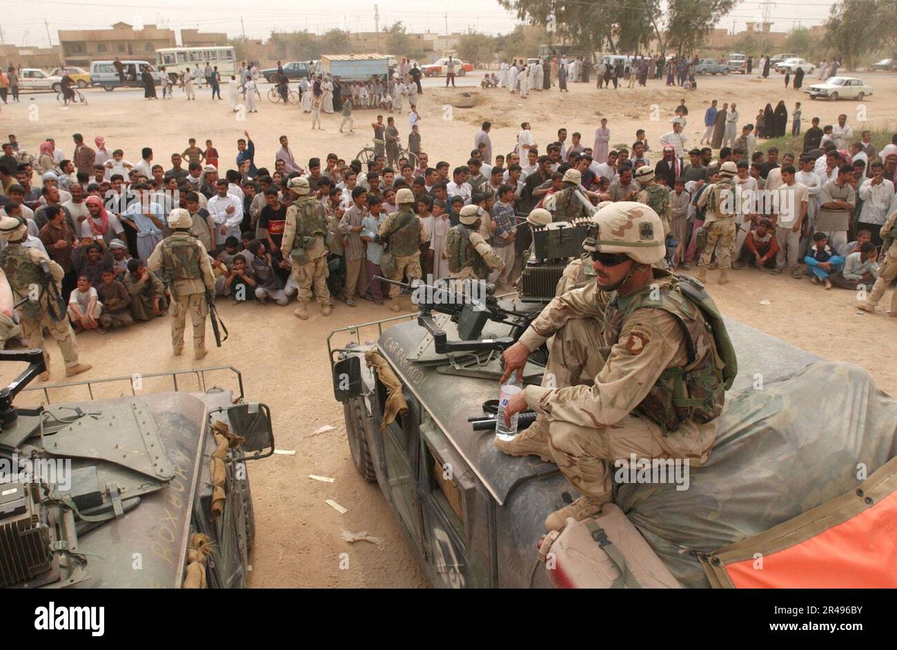 US Navy U.S. Army military police provide crowd control while Iraqi ...