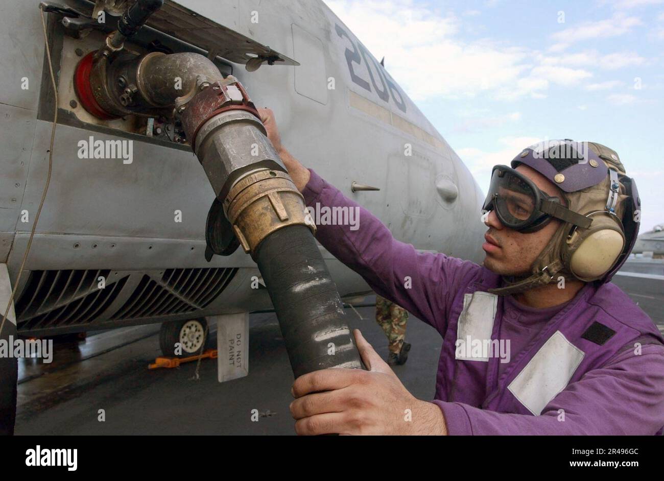 US Navy An Aviation Boatswain's Mate fuels an F-A-18 Hornet during ...