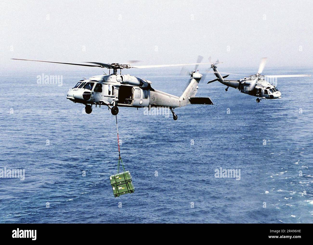 US Navy Two MH-60S Knight Hawks assigned to the Providers of Helicopter Combat Support Squadron ...
