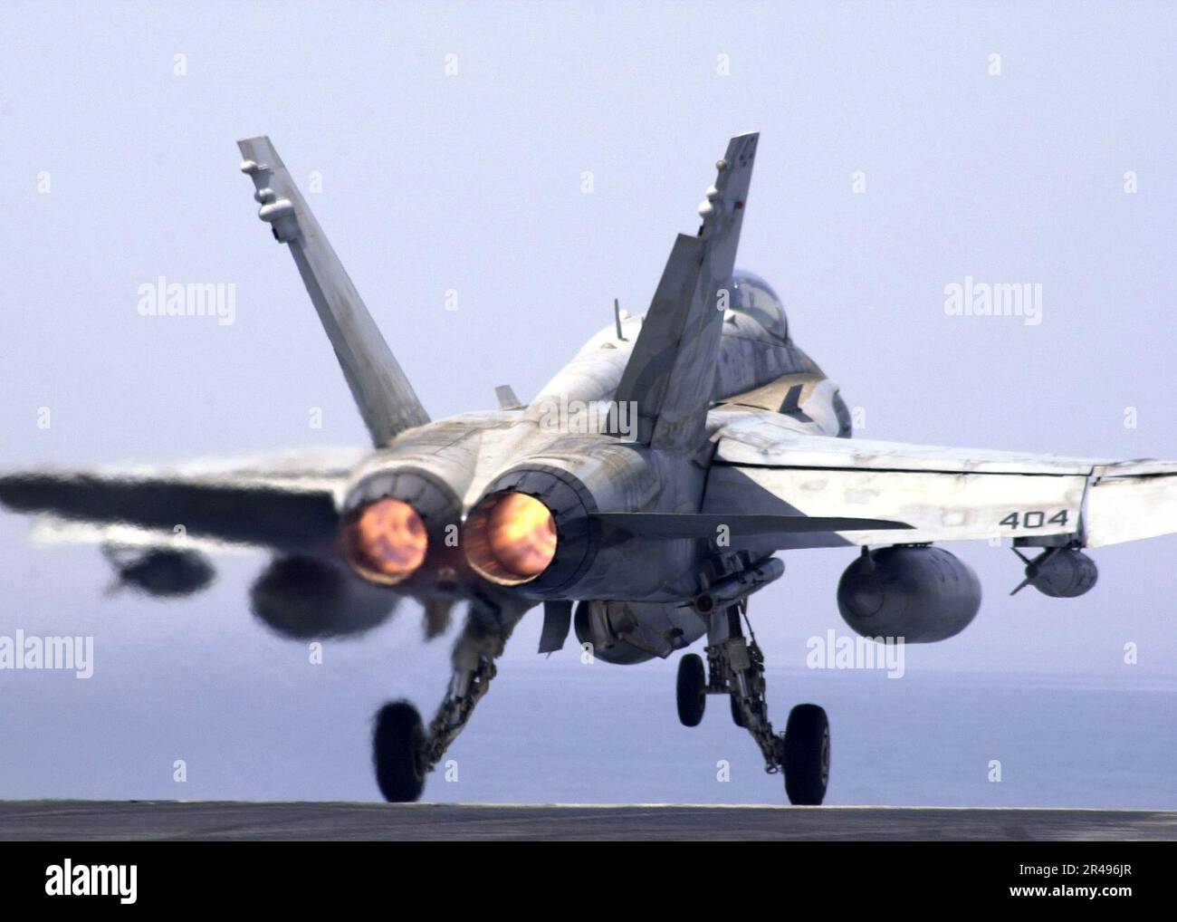 US Navy An F-A-18C Hornet launches in full afterburner from one of four ...