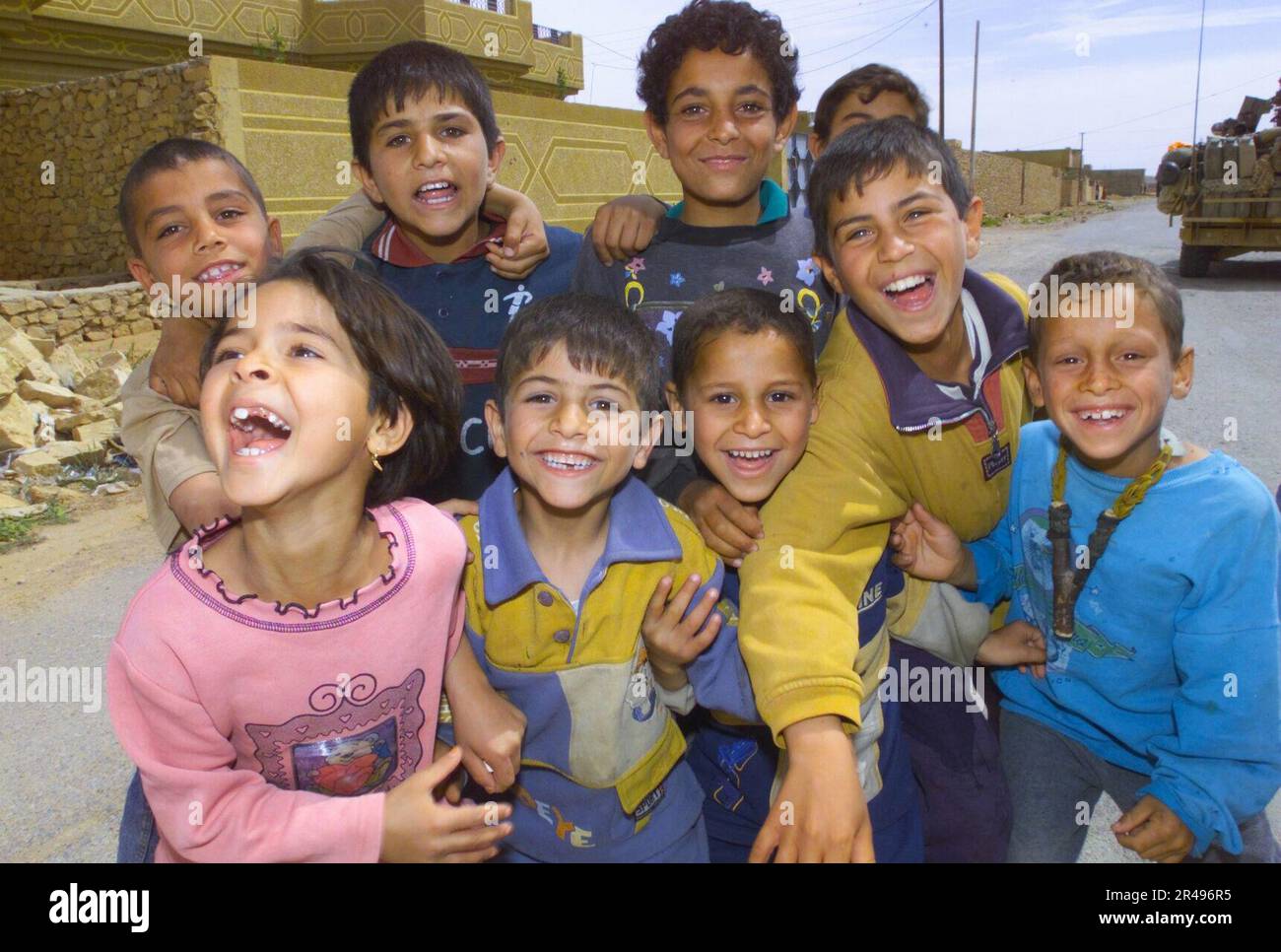 US Navy A group of Iraqi children pose for a photo while their parents ...