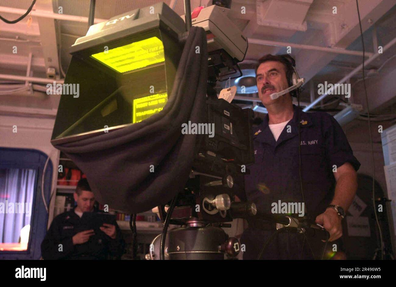 US Navy Journalist 1st class takes cues from the director during the ...
