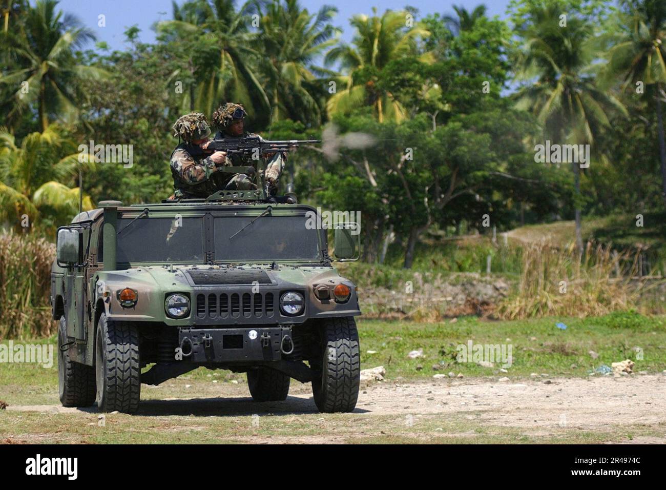 US Navy U.S. Marines fire a 7.62mm M-240 Medium Caliber Machine Gun ...