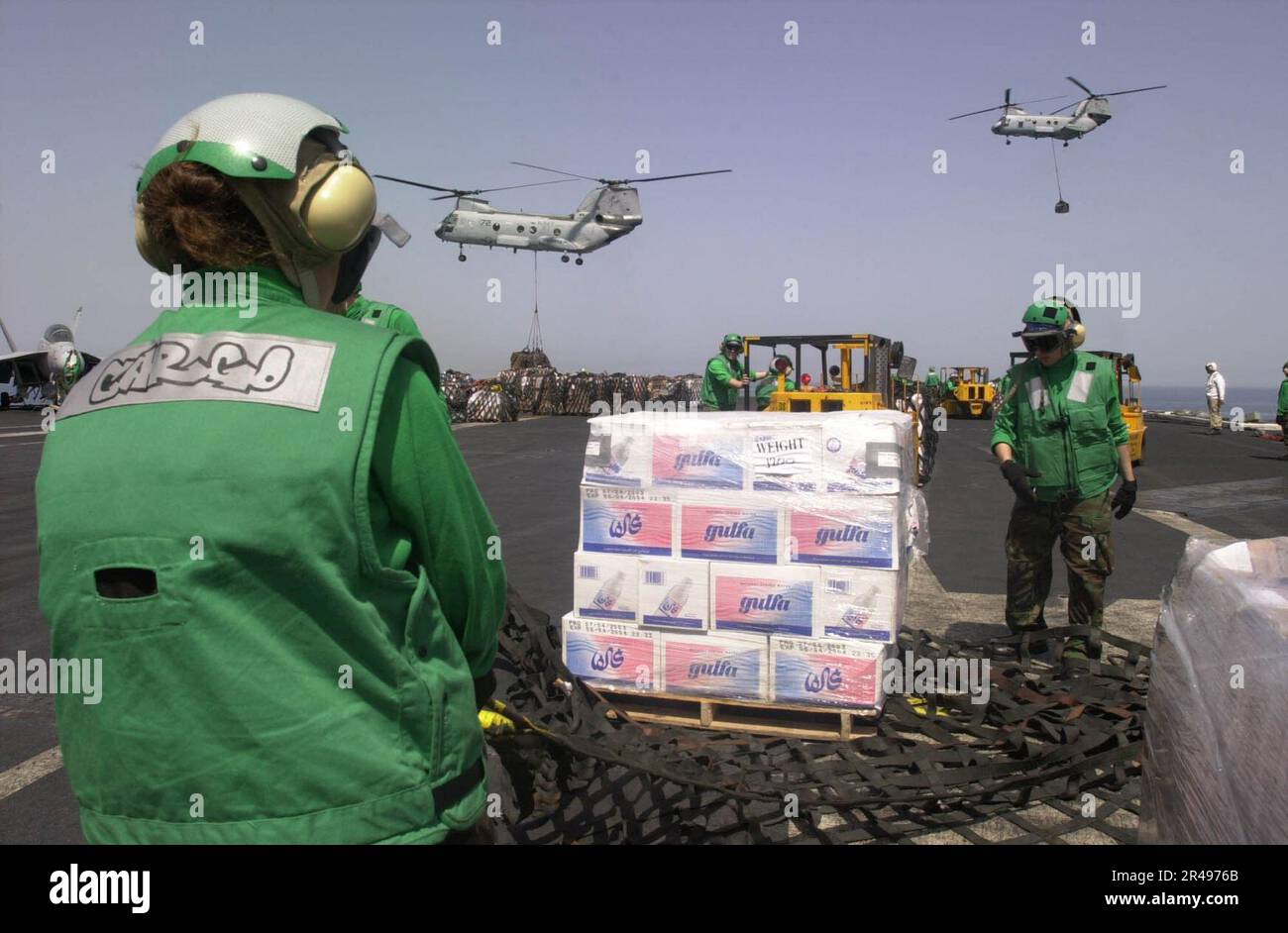 US Navy Crewmembers aboard USS Nimitz (CVN 68) unload nearly 300 ...