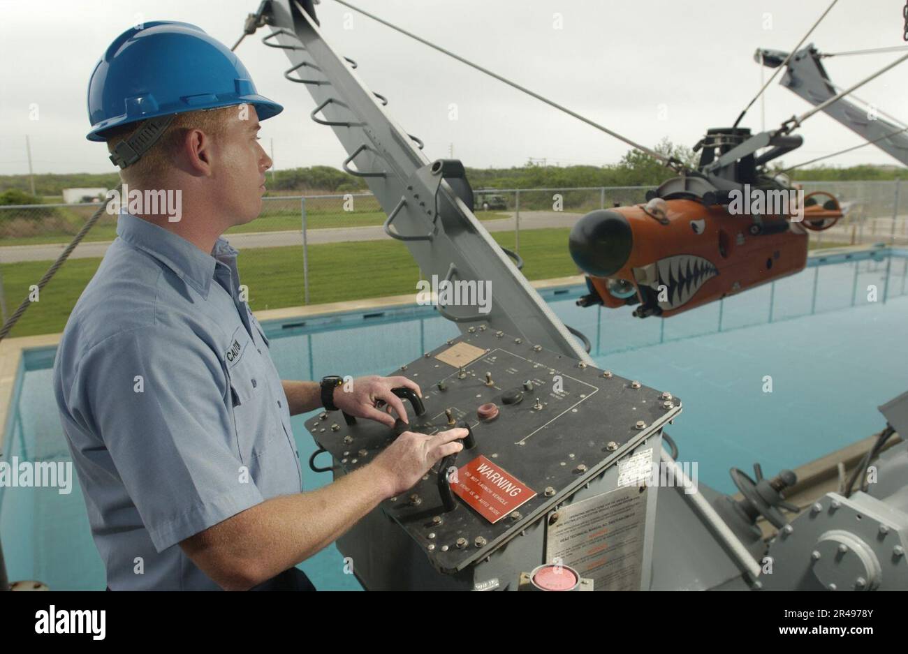 US Navy Mineman 1st Class prepares to lower the AN-SLQ-48 Mine ...
