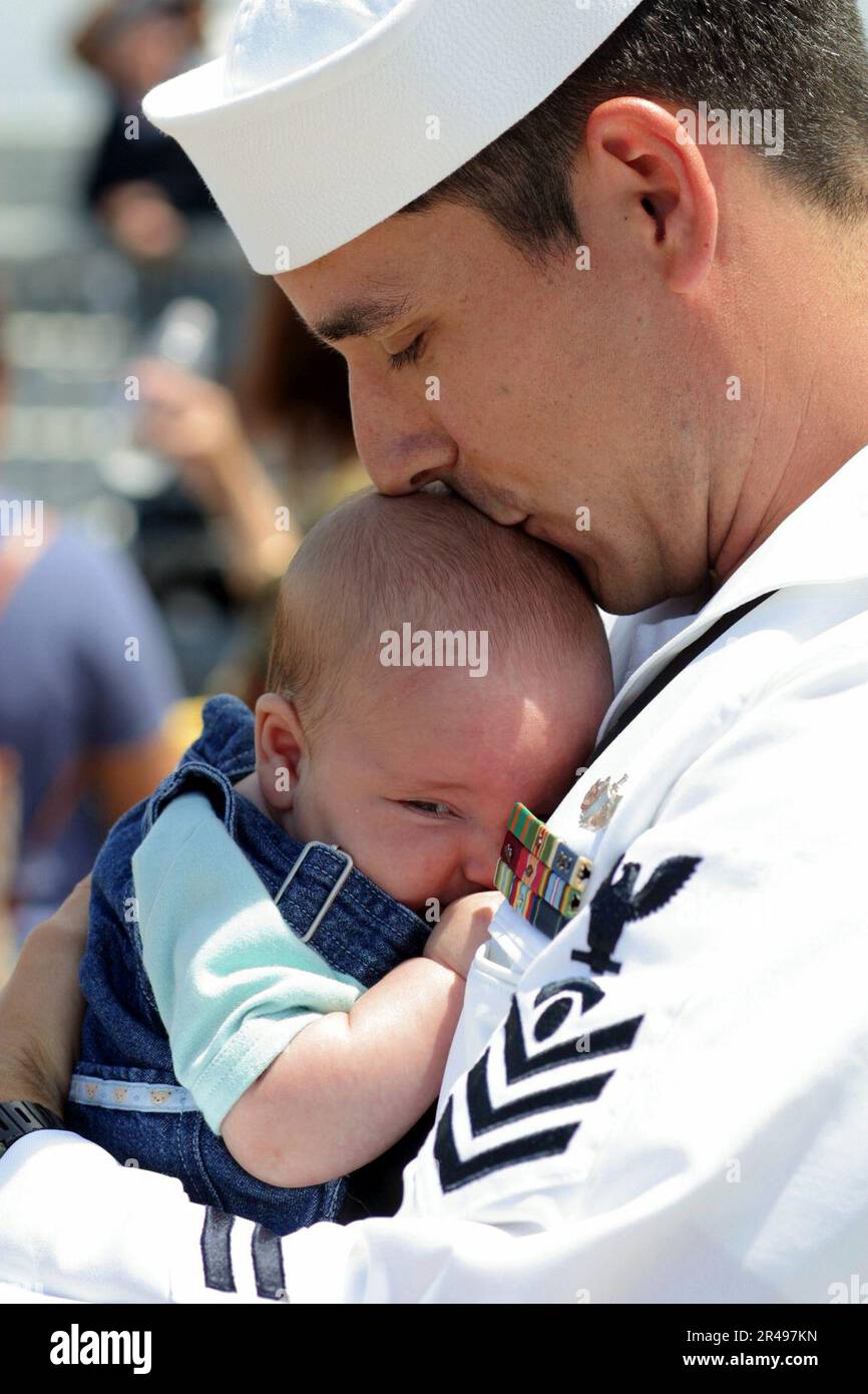 US Navy Interior Communications Electrician 1st Class meets his two ...