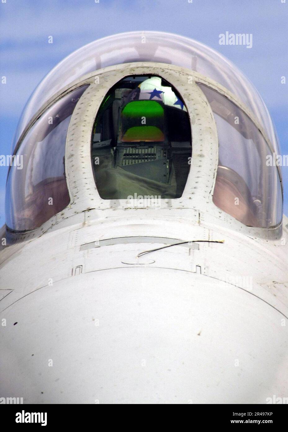 US Navy A pilot looks through his Heads-Up Display (HUD) as he checks ...