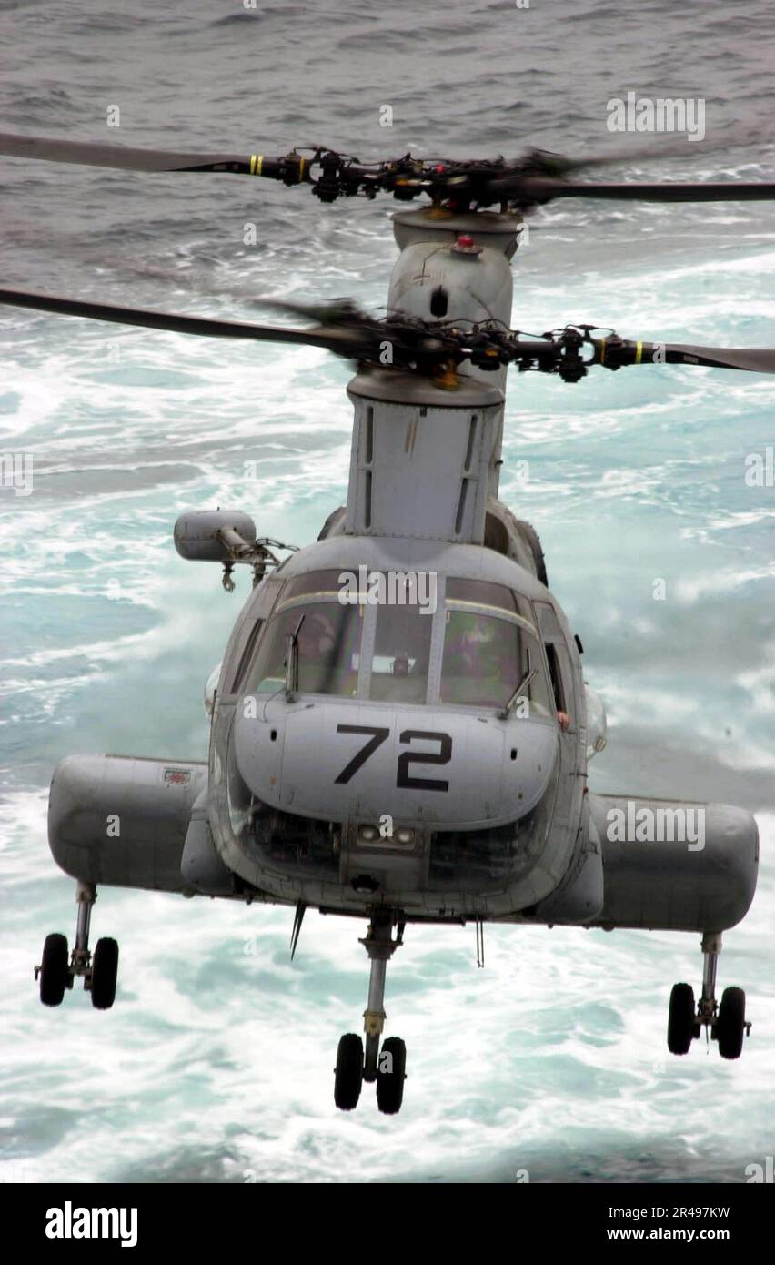 US Navy A CH-46 Sea Knight transfers supplies from fast combat support ...