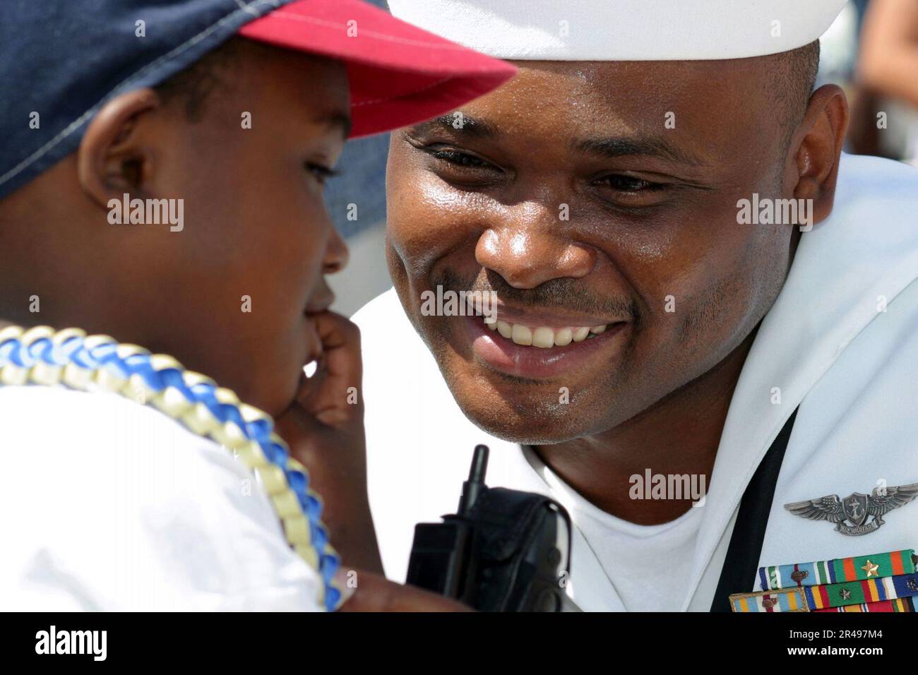 US Navy Yeoman 1st Class gets reacquainted with his son on the pier ...