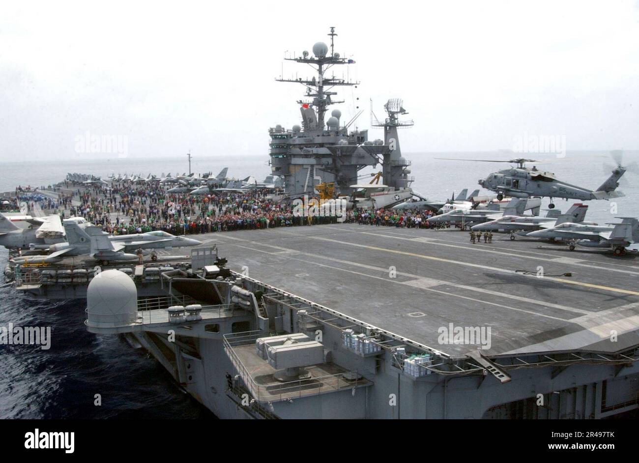 US Navy Ship's crew and visiting Congressional Delegates, watch as ...