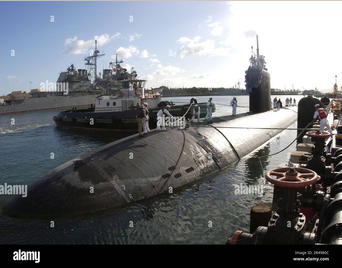 US Navy Sailors aboard the Los Angeles class attack submarine USS ...