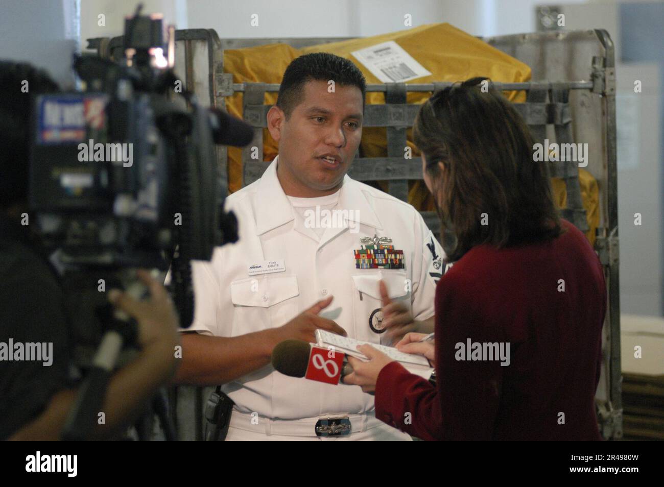 US Navy Postal Clerk 1st Class is interviewed by local media. More than ...