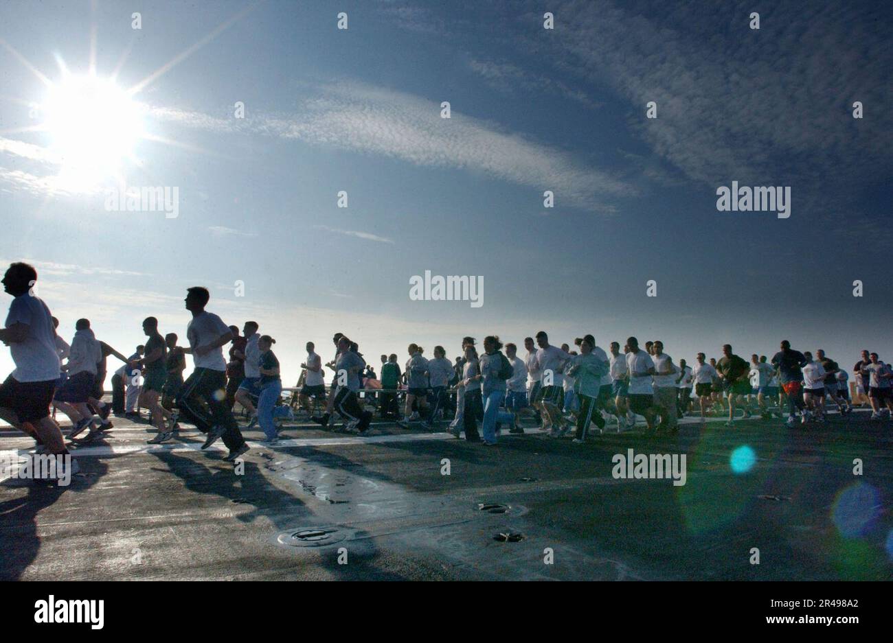 US Navy Sailors participate in a 5k run prior to the start of a steel ...