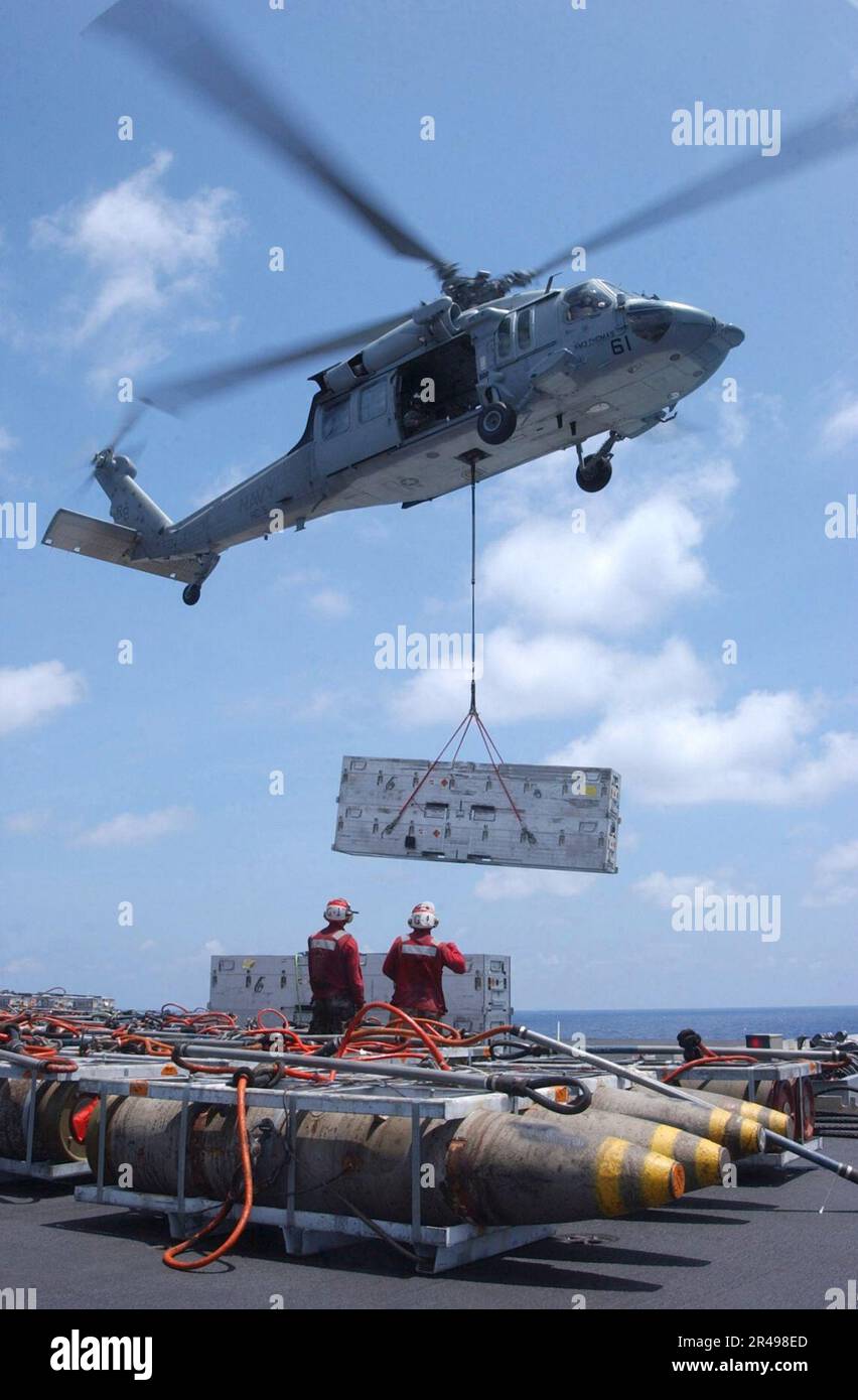 US Navy An SH-60 Seahawk hovers above flight deck aboard USS Kitty Hawk ...
