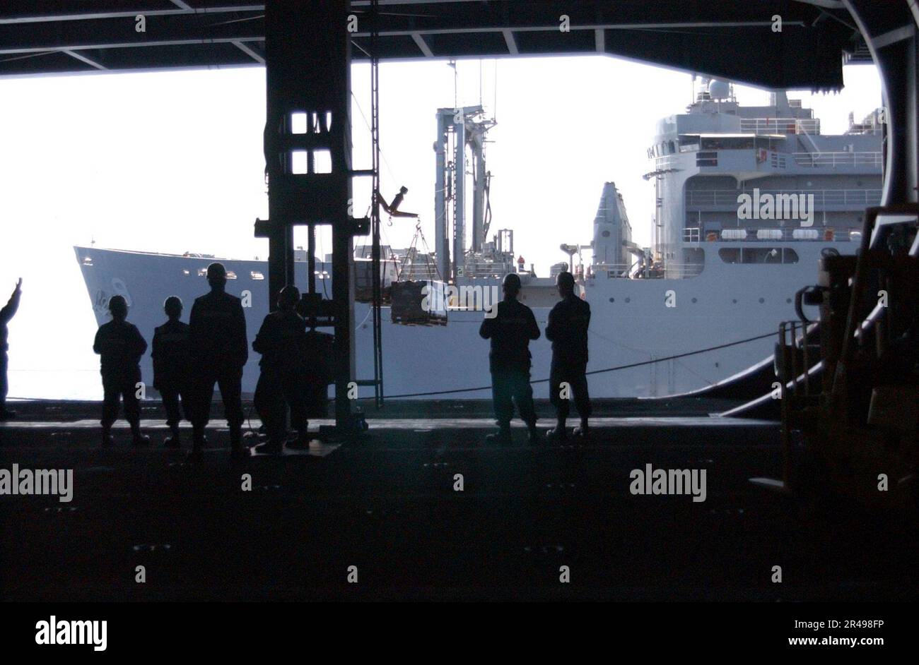 US Navy USS Harry S. Truman (CVN 75) receives food and other supplies ...