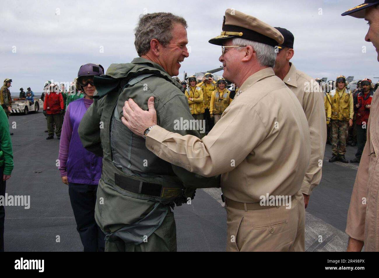 US Navy President George W. Bush greets Rear Admiral John Kelly on the ...