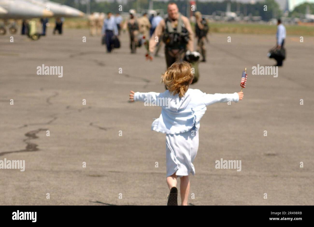 US Navy Two very happy little girls greet their father after he returns ...