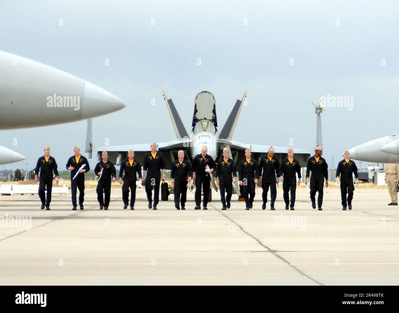 US Navy Pilots from Strike Fighter Squadron One One Five (VFA-115) walk ...