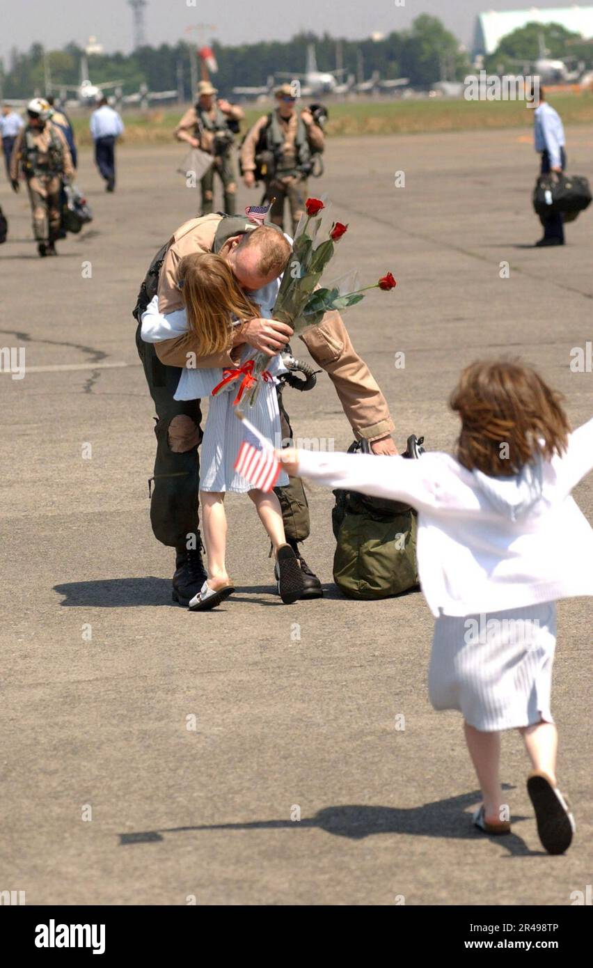 US Navy Two very happy little girls greet their father after he returns ...