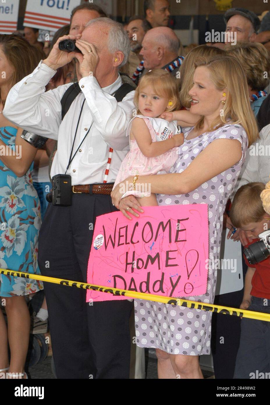 US Navy Family and friends eagerly await to welcome home sailors during ...