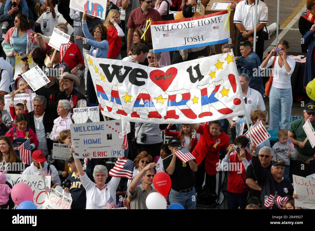 US Navy Family and friends gather on the pier to show their support, as ...